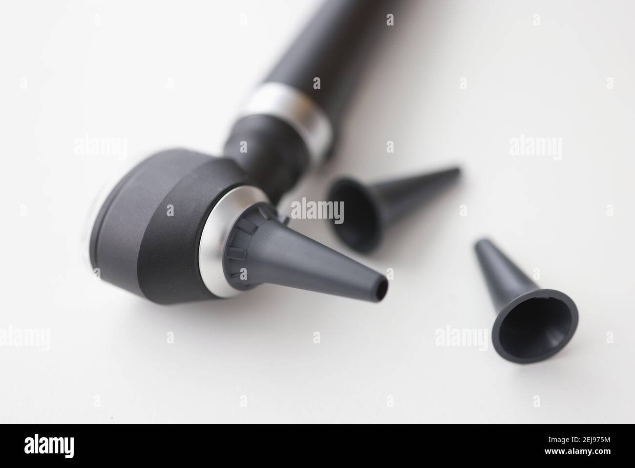 Closeup of otorhinolaryngologist otoscope tool on white background ...