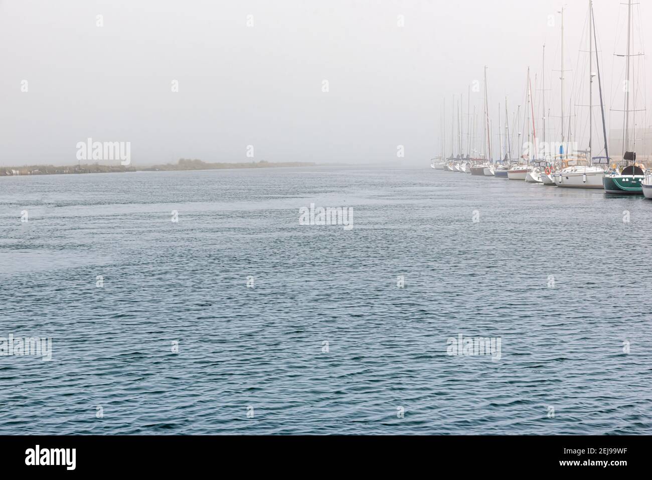 Sea port in Portugal in the daytime with grey sky due to the fog Stock ...