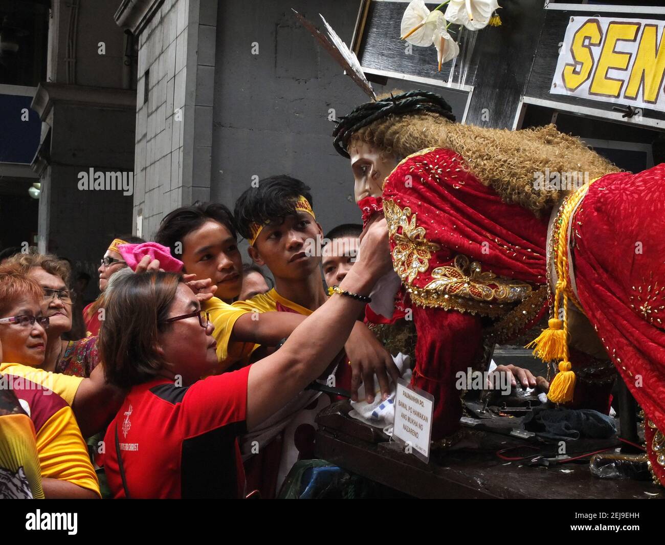 Nazarene devotees alternatively wipe the face of the Nazarene statue ...