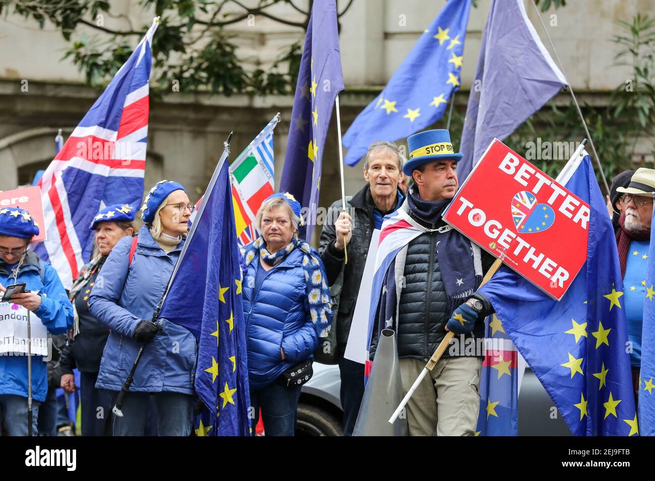 Pro European campaigners hold placards and Union Jack and EU flags in ...
