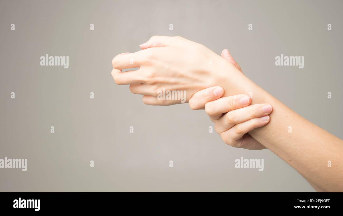 Tired woman feeling pain, massaging tense muscles Stock Photo - Alamy