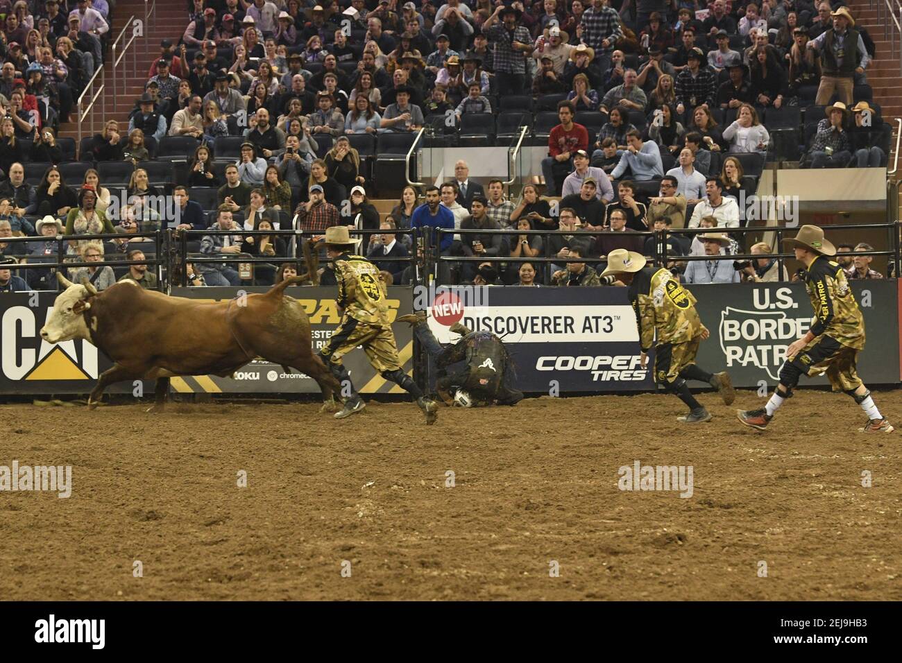 Dylan Smith Takes a Hit from Mickey Mouse during the Professional Bull ...