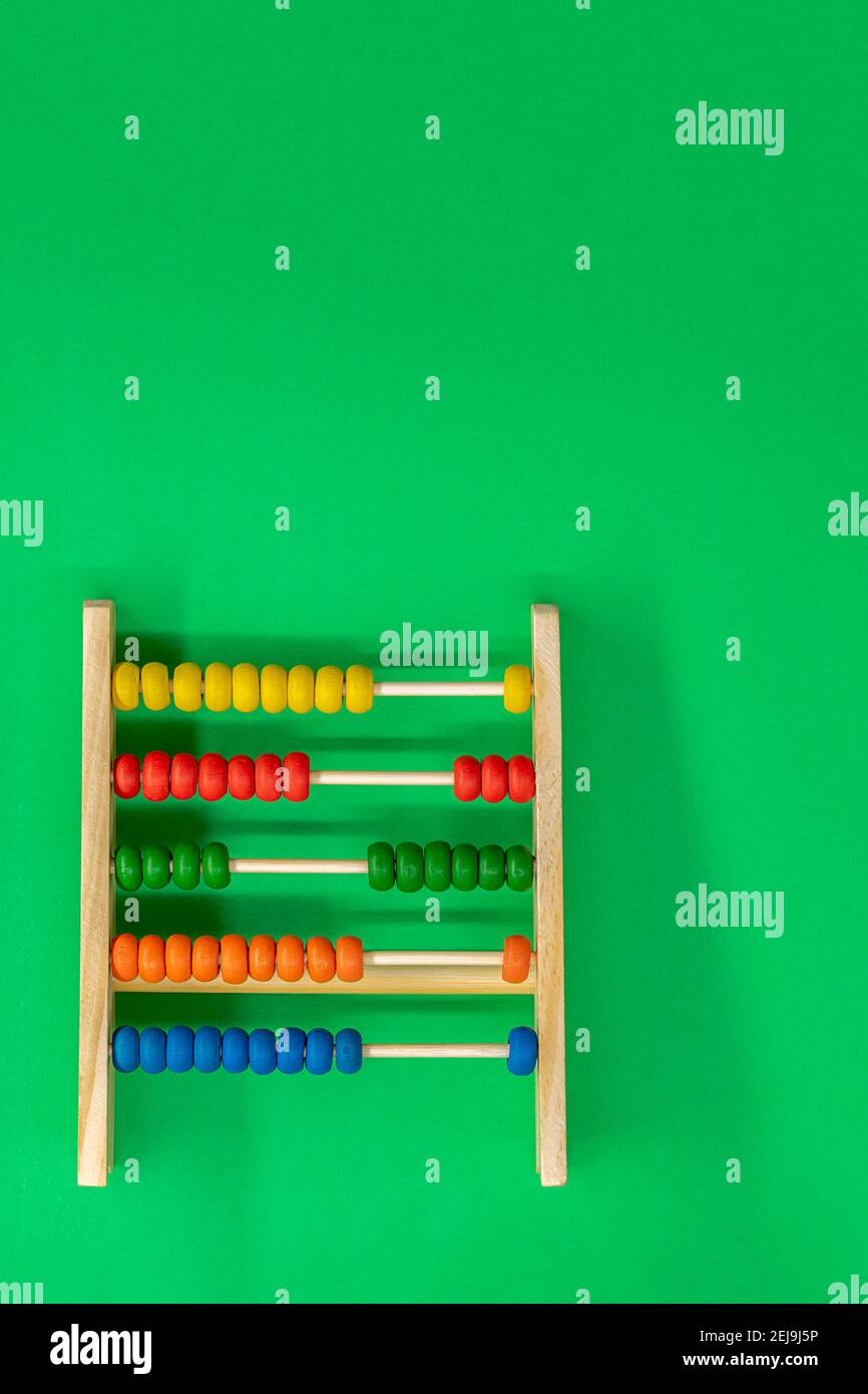 Abacus symbol for learning math on a green background, copy space Stock ...