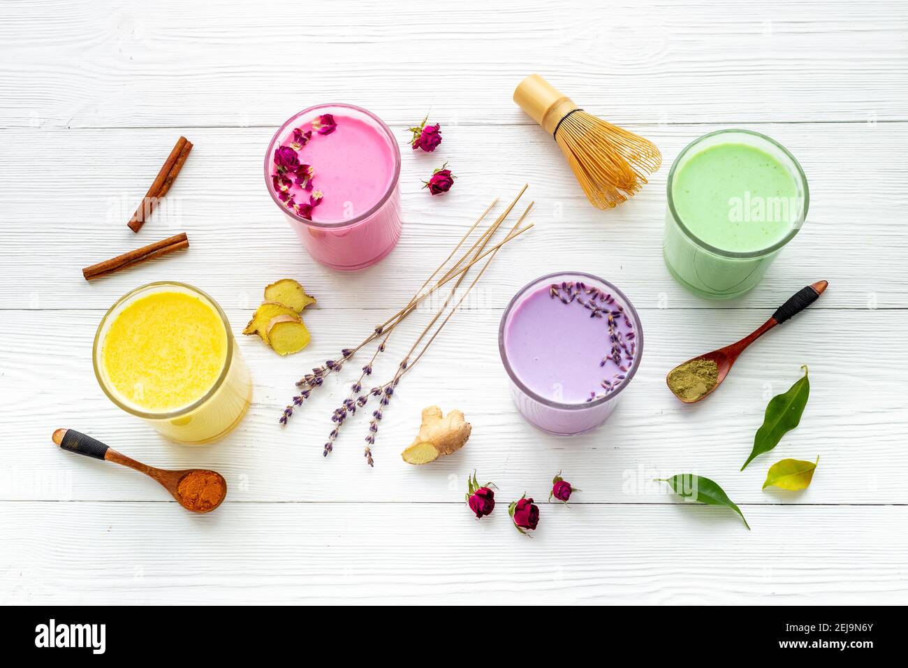 Green, yellow and pink latte. Hot colorful coffee or tea with milk ...