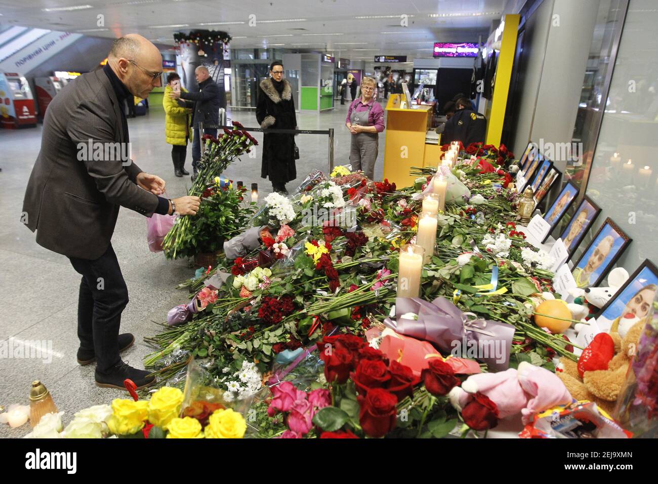 A man pays respect to the victims of flight PS 752 at the memorial ...