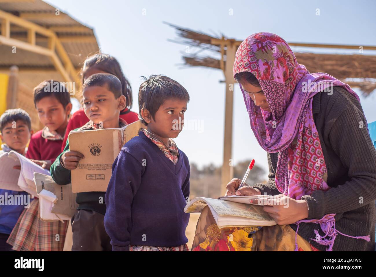 Correcting children hi-res stock photography and images - Alamy