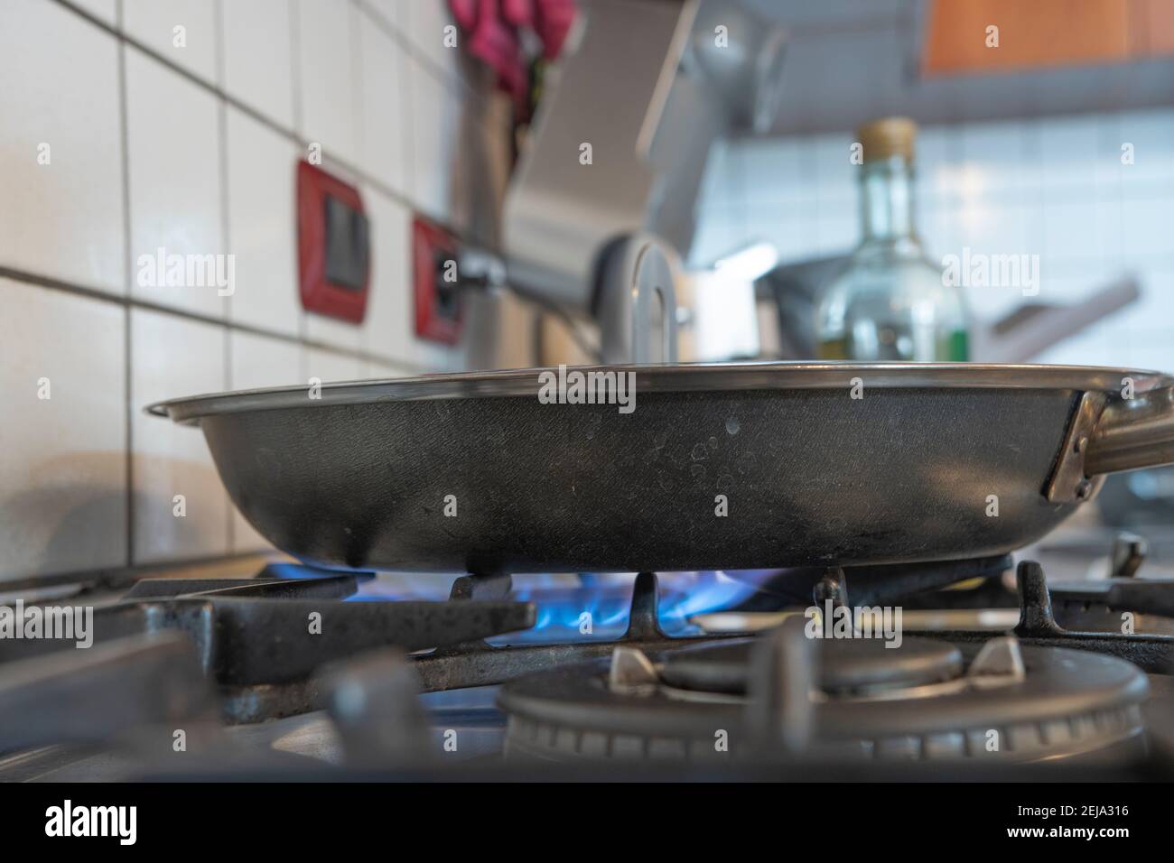 Pan cooking meal on a gas stovetop Stock Photo - Alamy