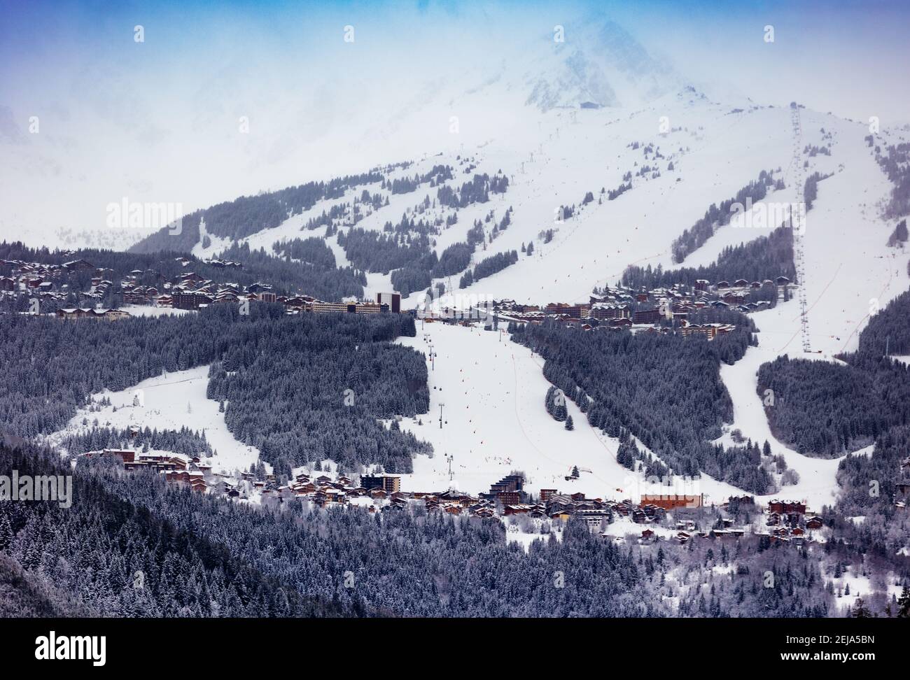 View of Courchevel ski resort slopes village, valley of Alps mountain ...