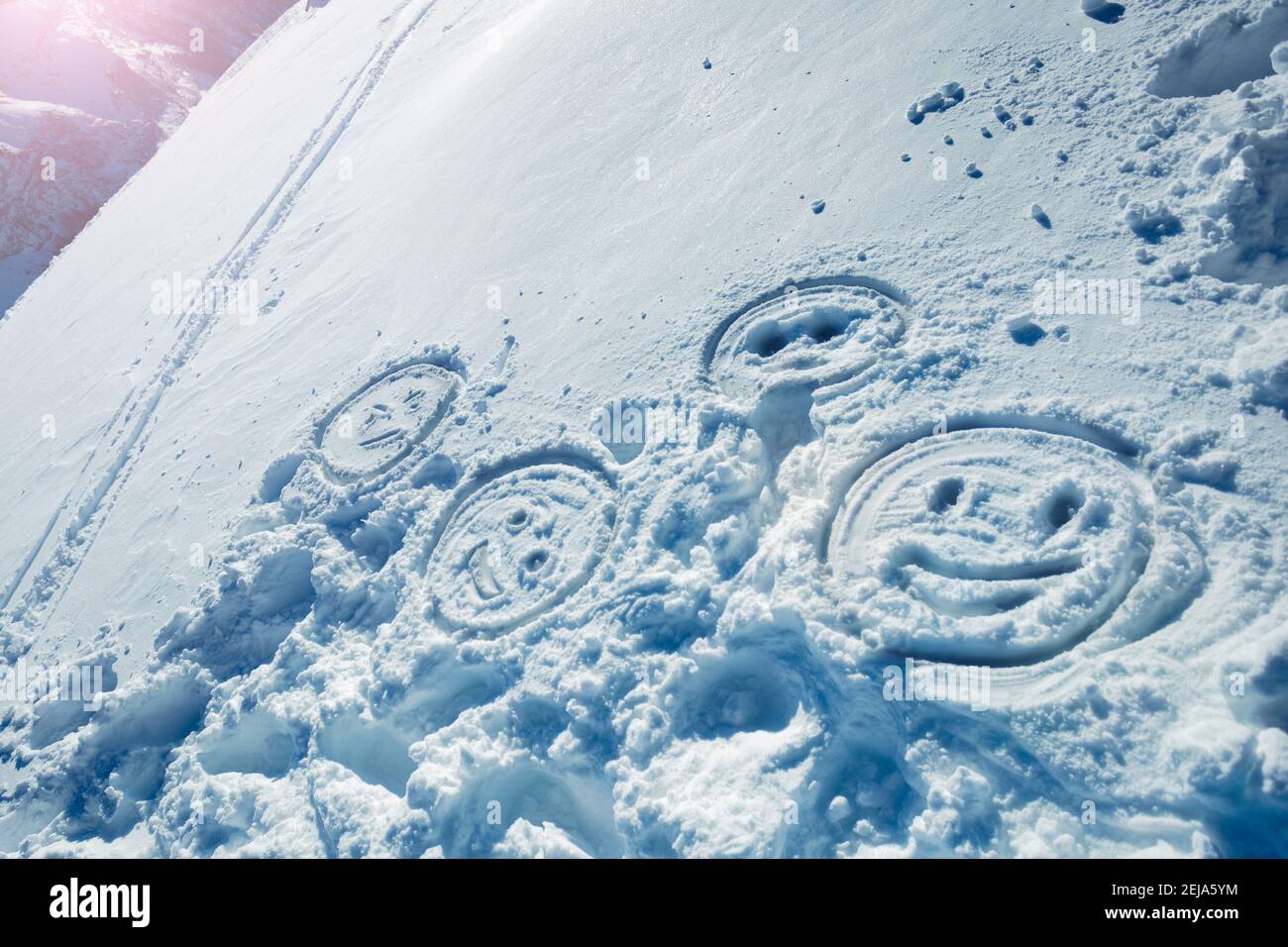 Happy smile faces in the snow on the mountain with sun flare Stock ...