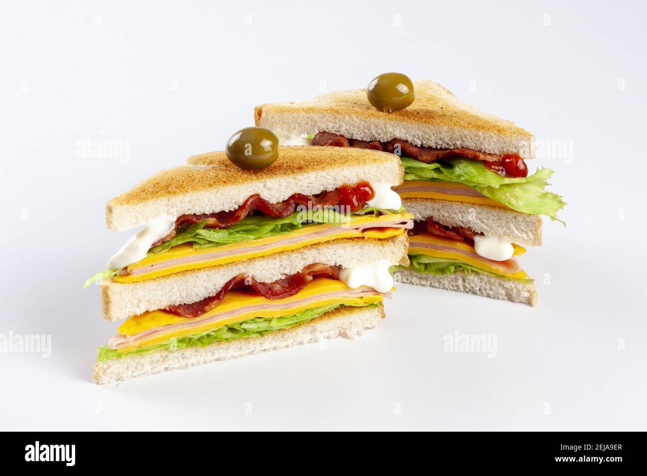 Double sandwiches with fresh and delicious ingredients isolated on a ...