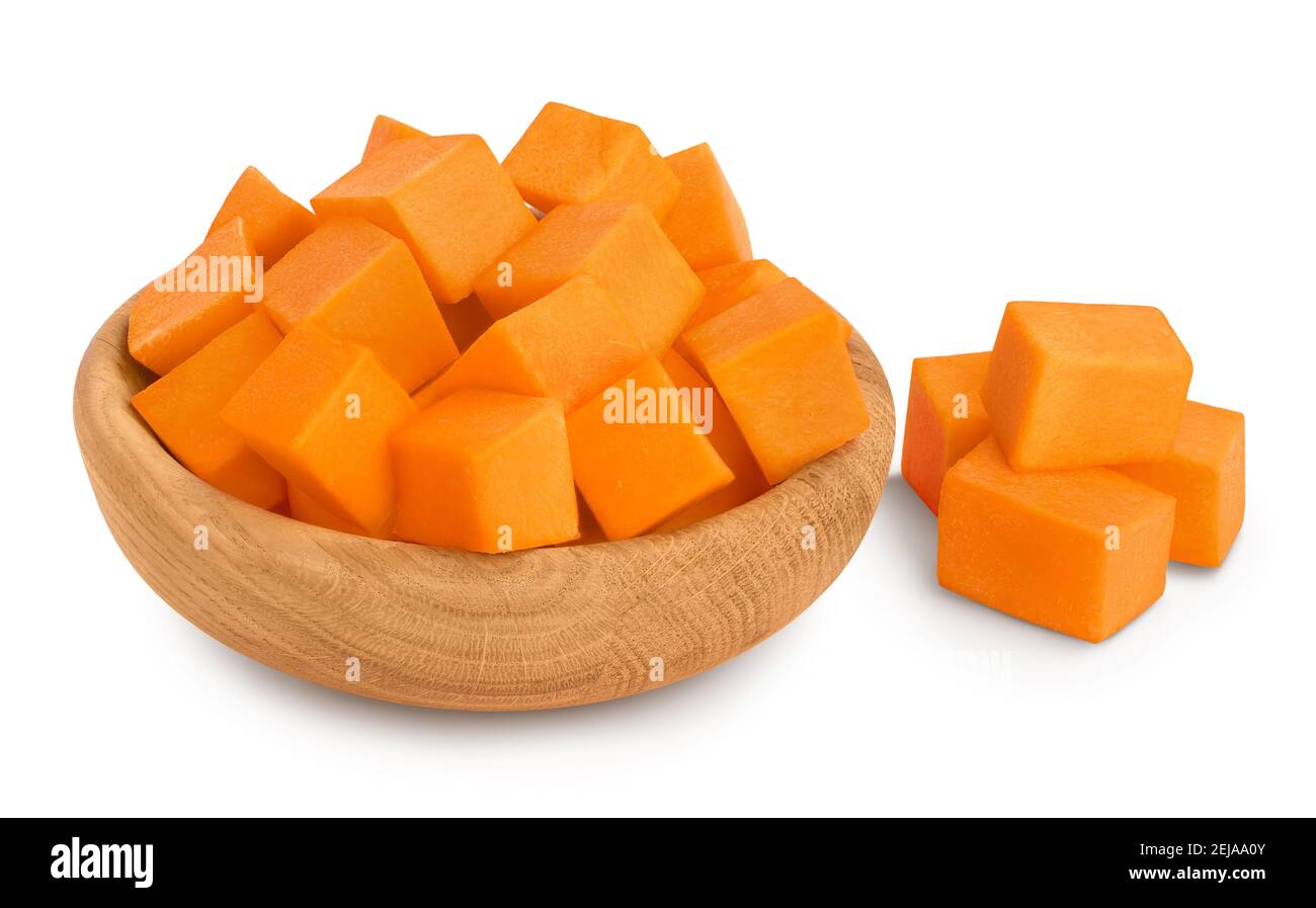 butternut squash diced in wooden bowl isolated on white background with ...