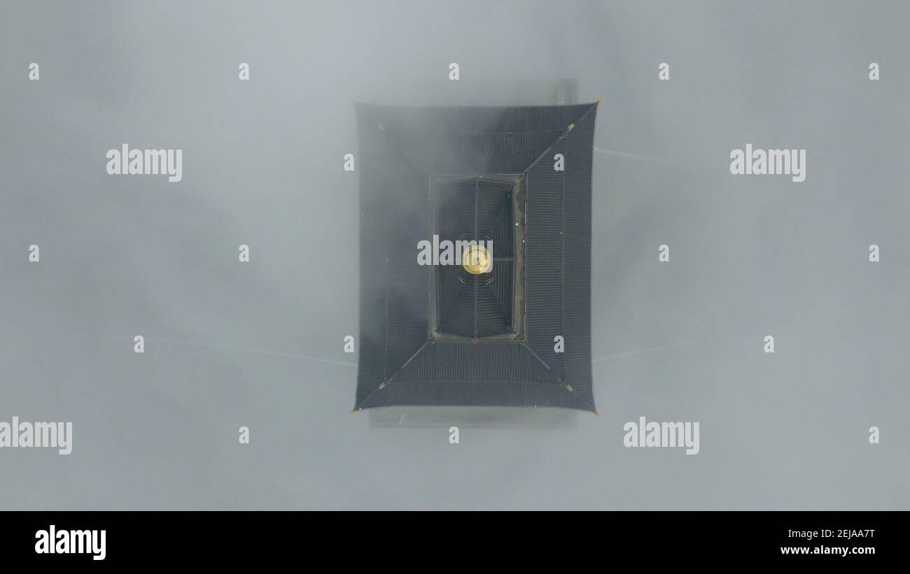 The landmark Wanfu Bridge is shrouded by dense fog in Yangzhou City ...