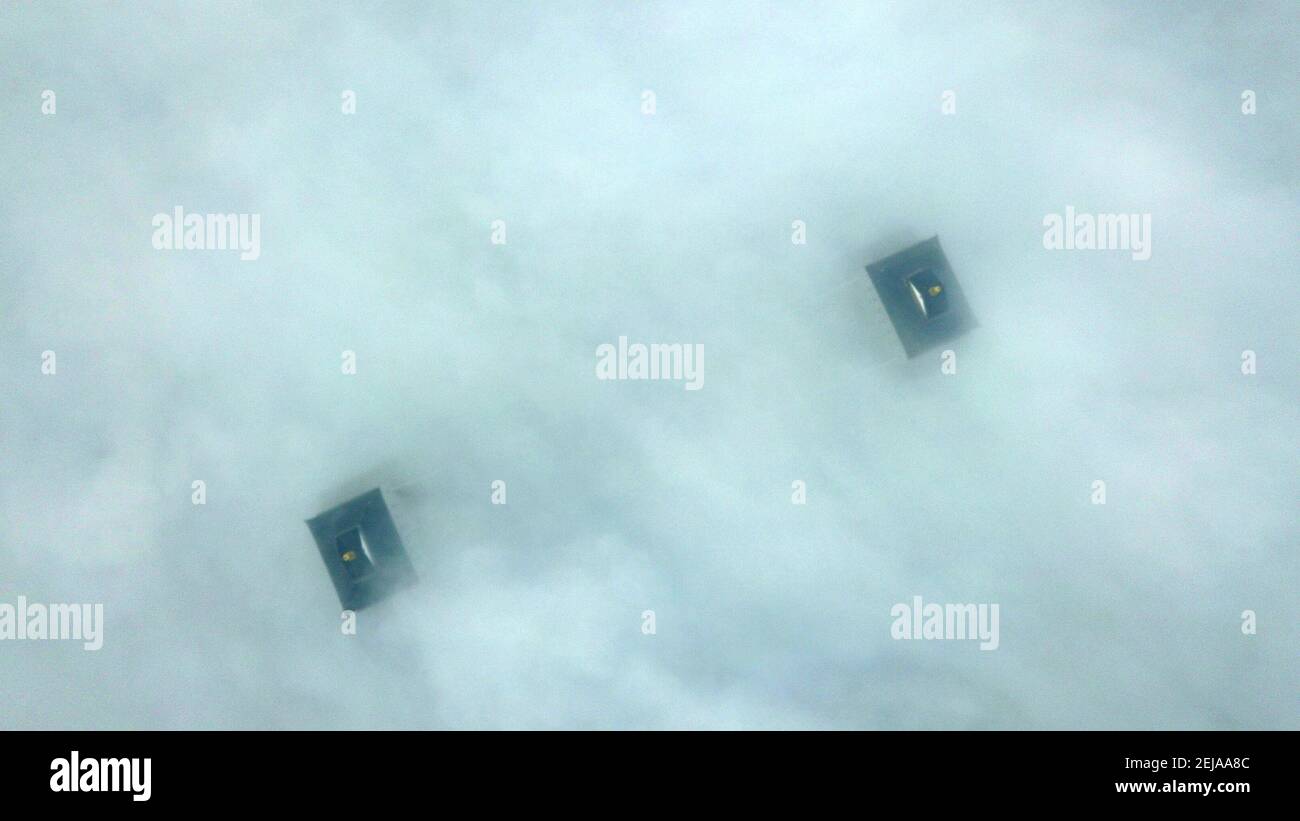 The landmark Wanfu Bridge is shrouded by dense fog in Yangzhou City ...