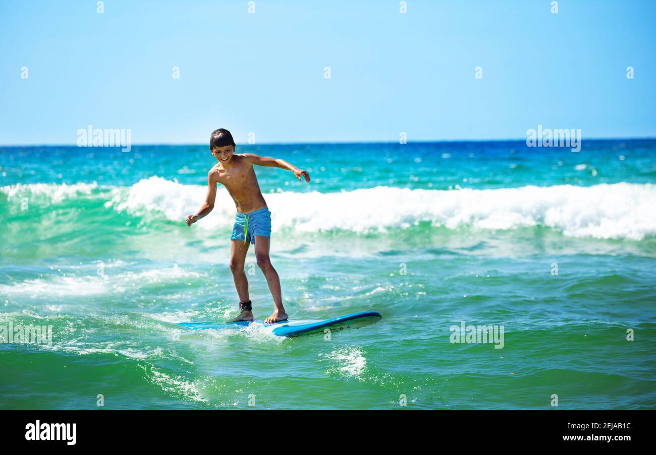 Boy with surfboard hi-res stock photography and images - Alamy