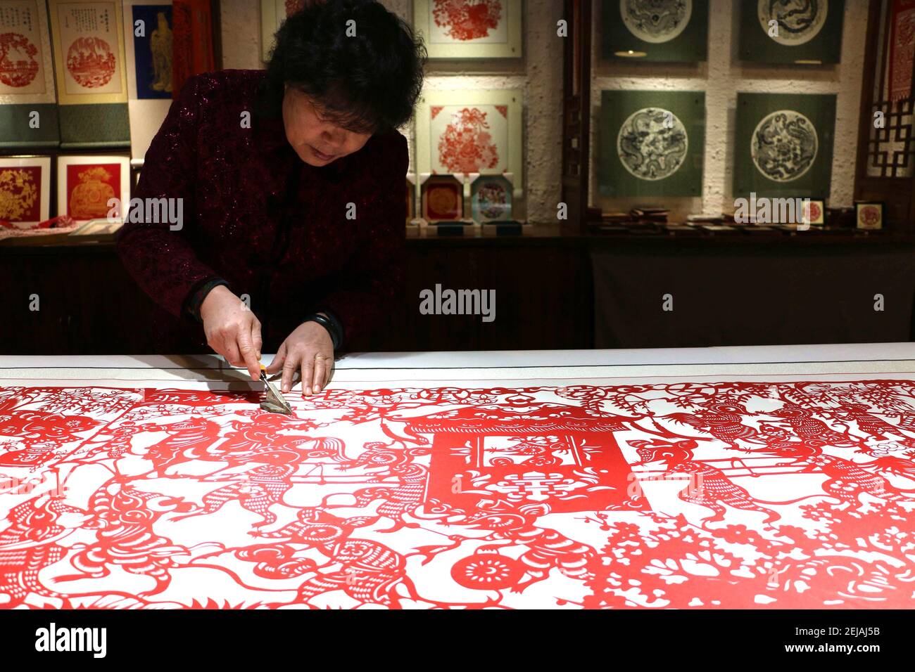Chinese paper-cut artist Shi Junfeng puts final touches on her latest ...