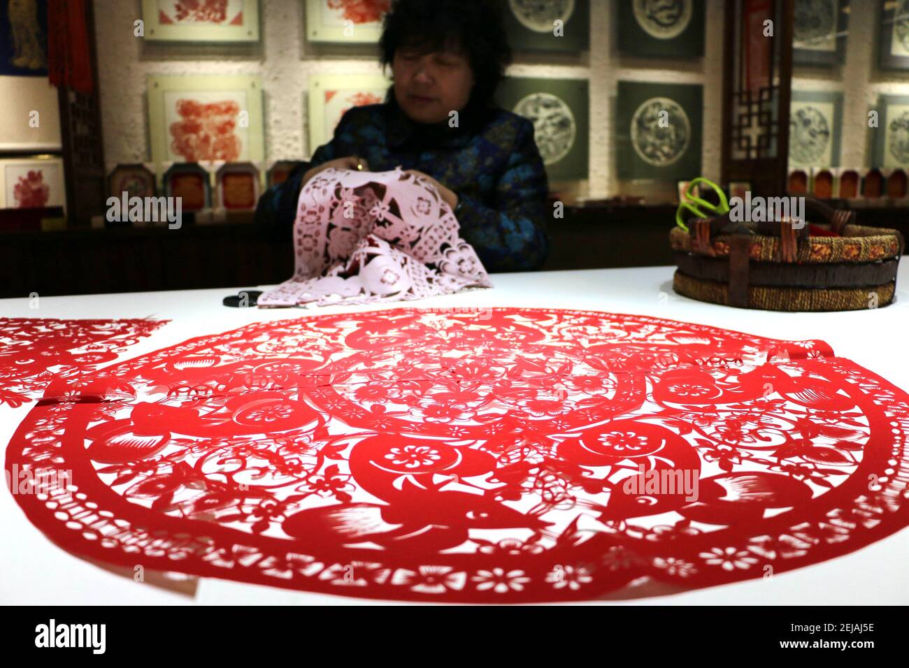 Chinese paper-cut artist Shi Junfeng puts final touches on her latest ...
