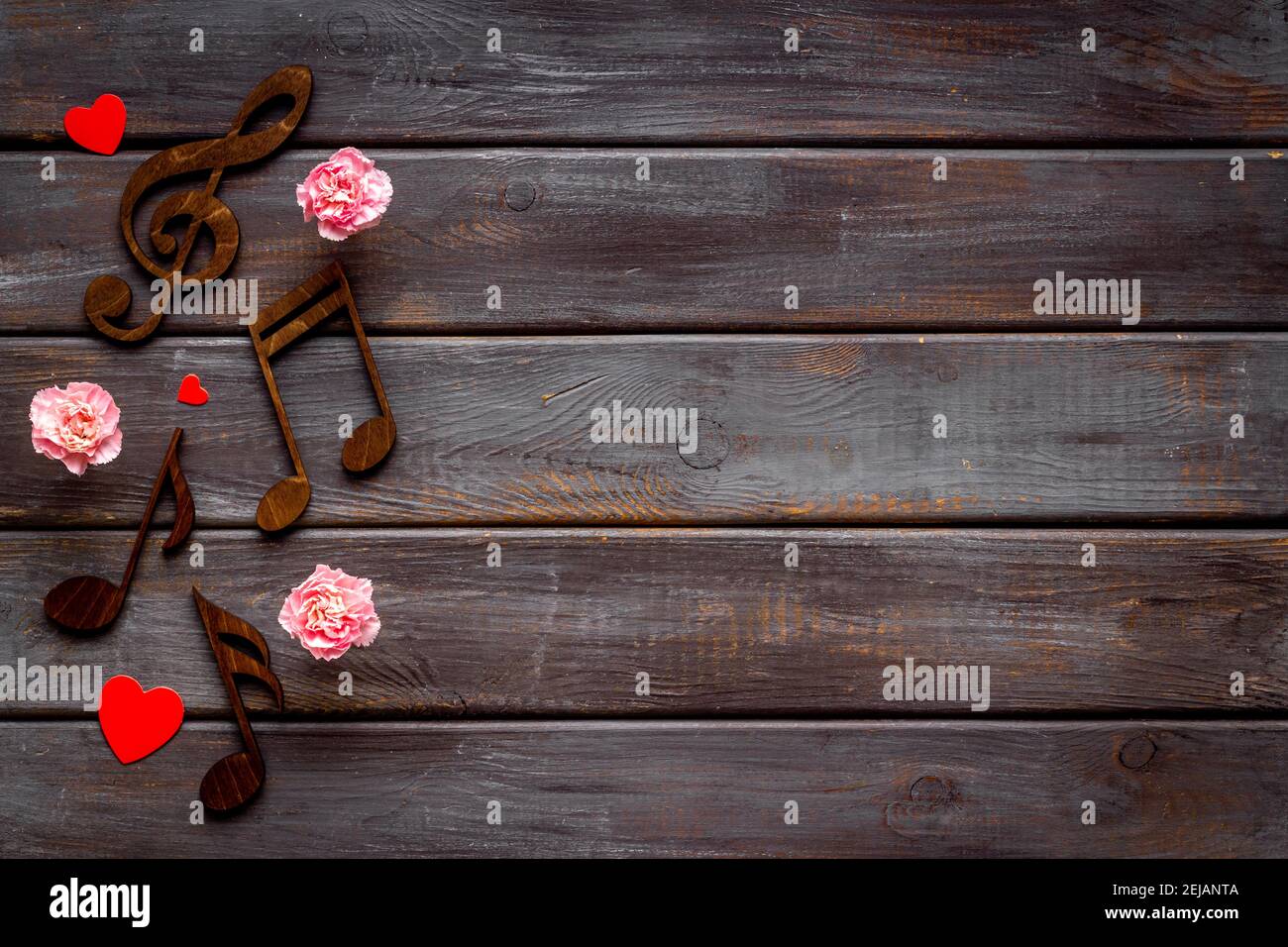 Musical wooden notes with flowers. Top view. Love songs concept Stock ...
