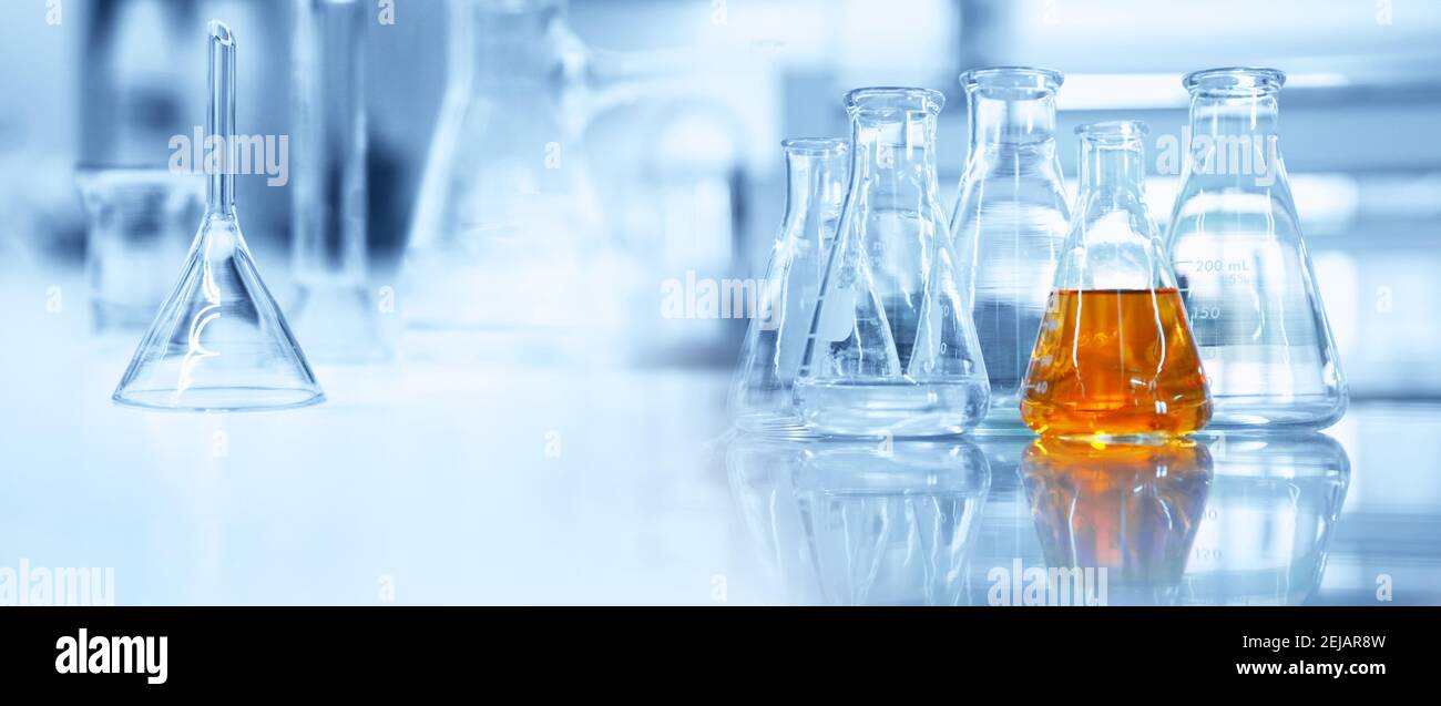 flask and glassware equipment in chemistry science laboratory blue ...