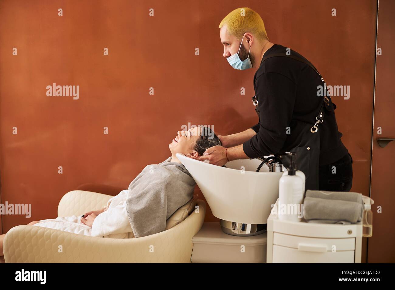 Woman shampooing her hair hi-res stock photography and images - Alamy