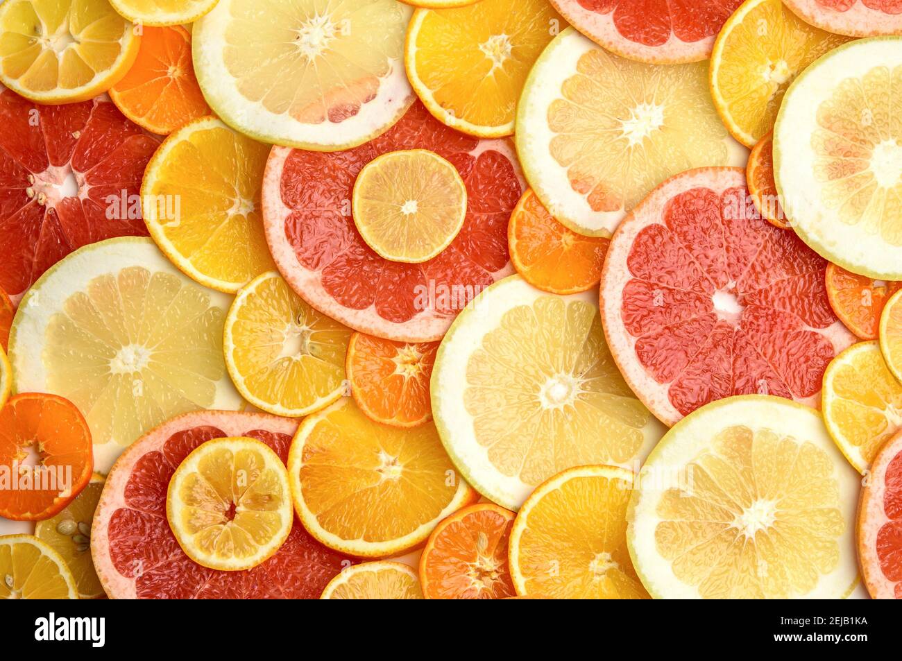citrus fruits cut into round pieces: orange, grapefruit, lemon ...