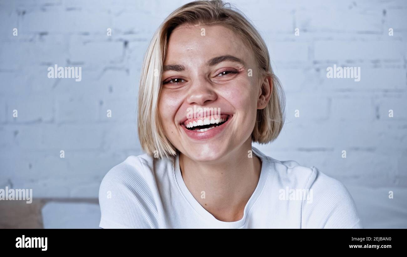 Blonde woman laughing hi-res stock photography and images - Alamy