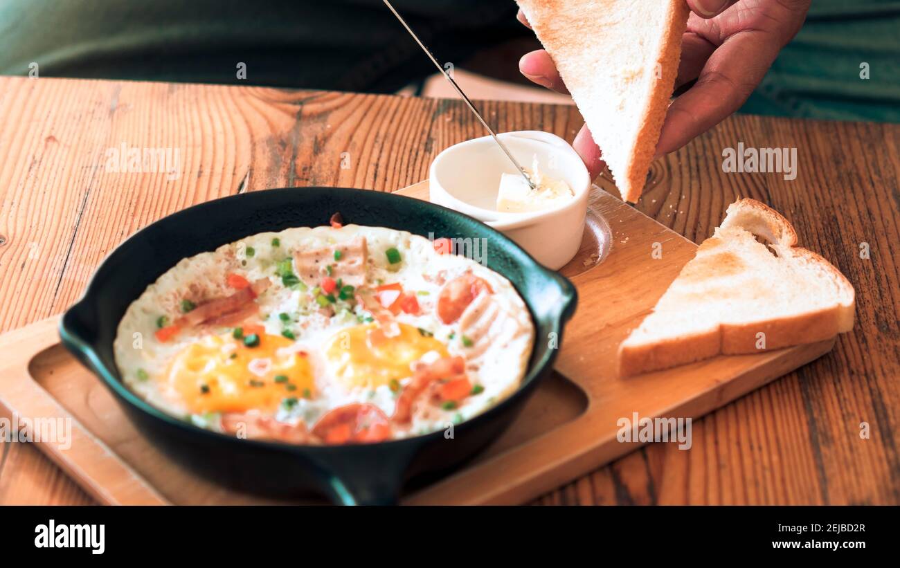 Person spreading bread butter hi-res stock photography and images - Alamy