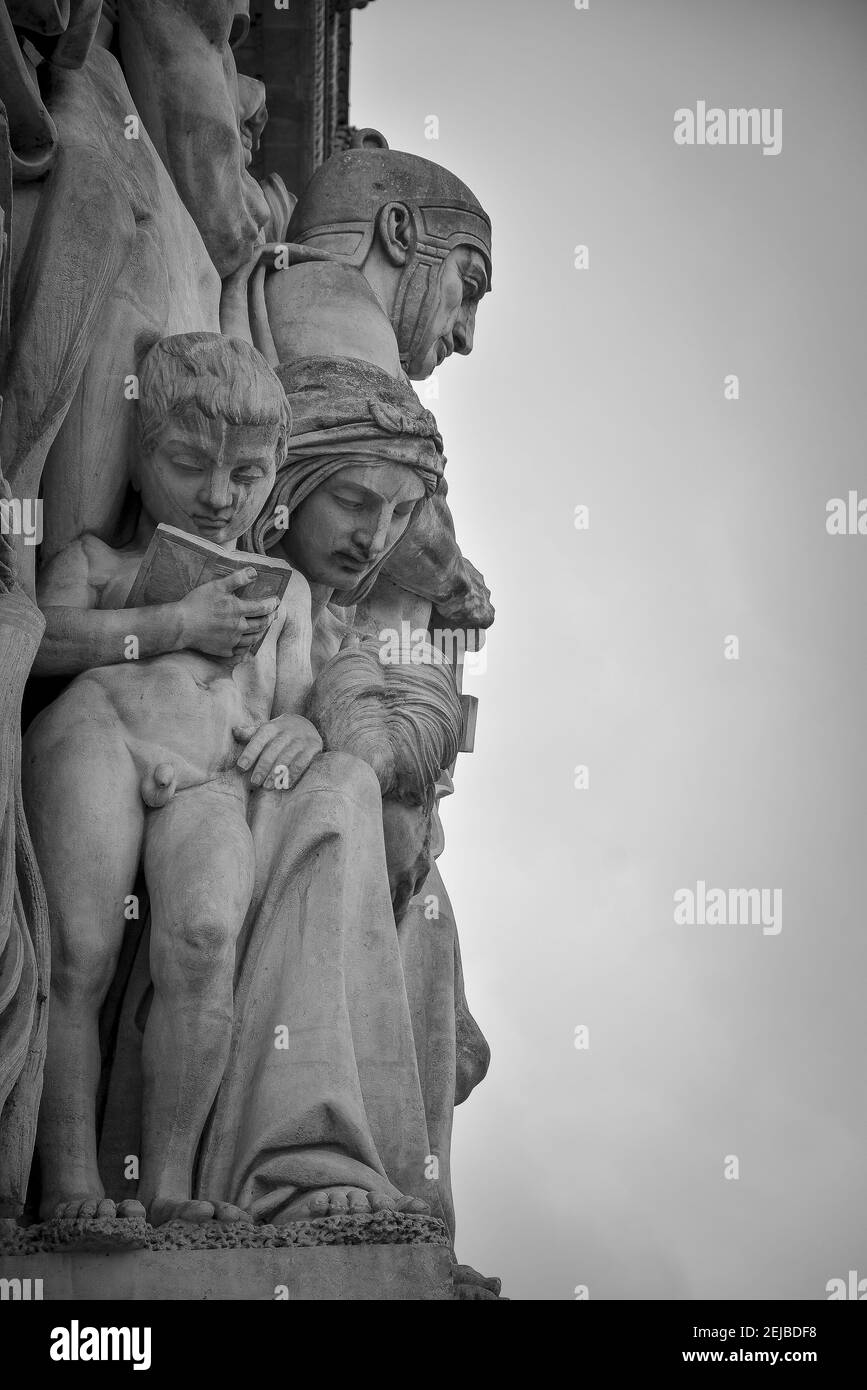 Vertical grayscale shot of human statues on the building Stock Photo ...
