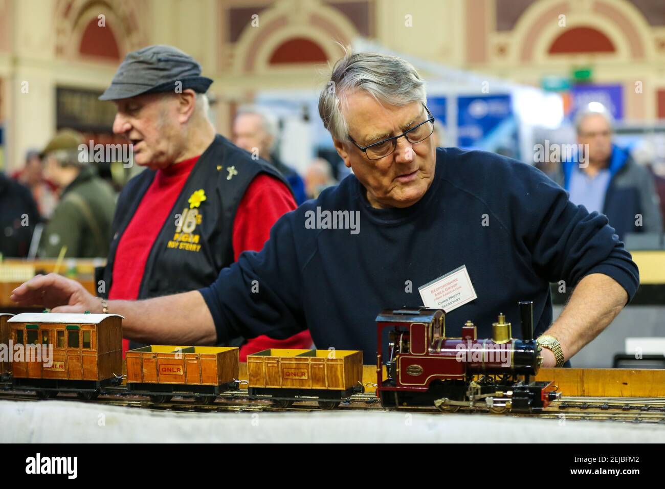 An exhibitor operates miniature train models during the exhibition at ...