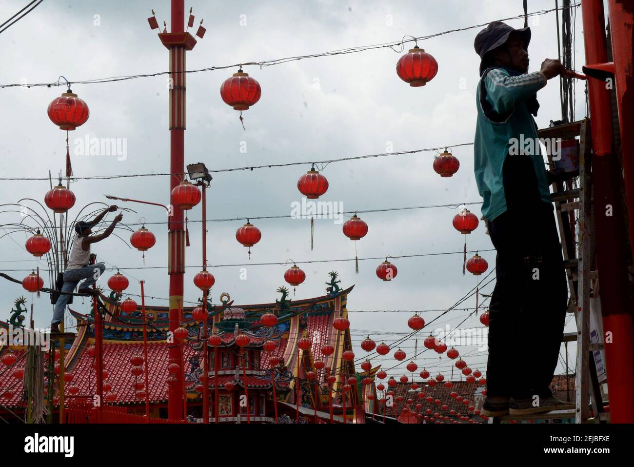 Ahead of the Chinese New Year, residents of Chinese descent put ...