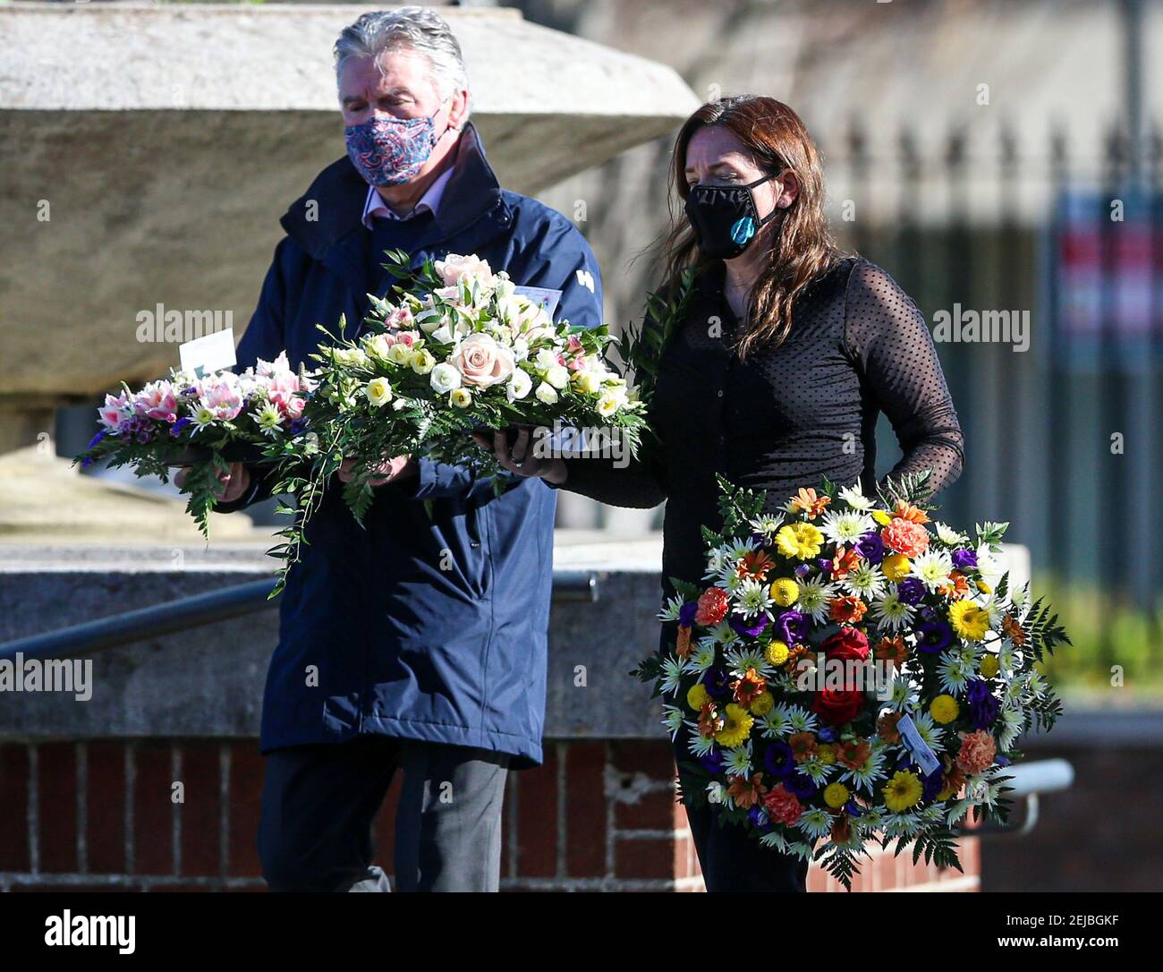 People arrive with flowers for the the funeral mass of Dr Emer Feely ...
