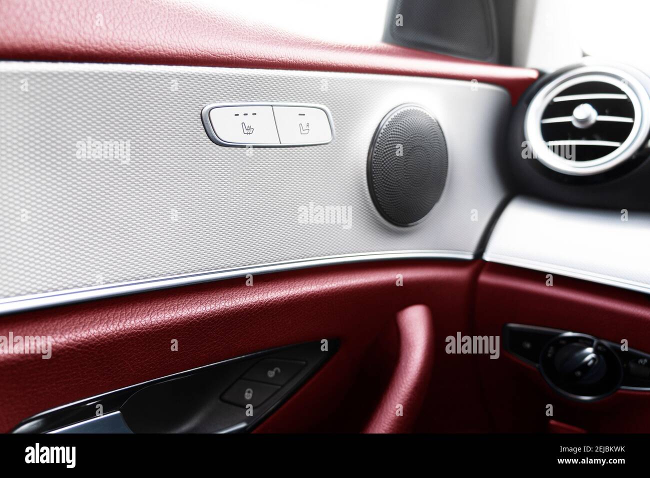 Car door handle inside the luxury modern car with red leather texture ...