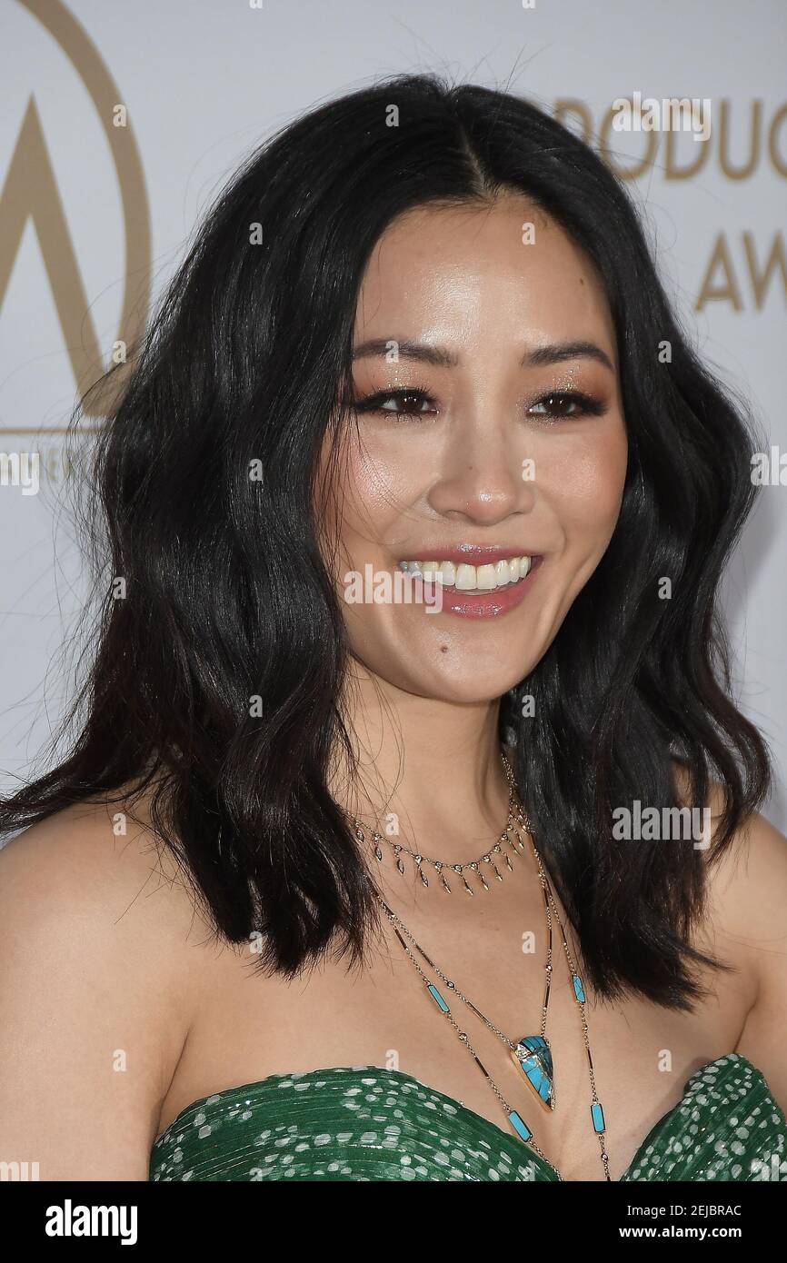 Constance Wu walks the carpet at the 31th Annual Producers Guild Awards ...