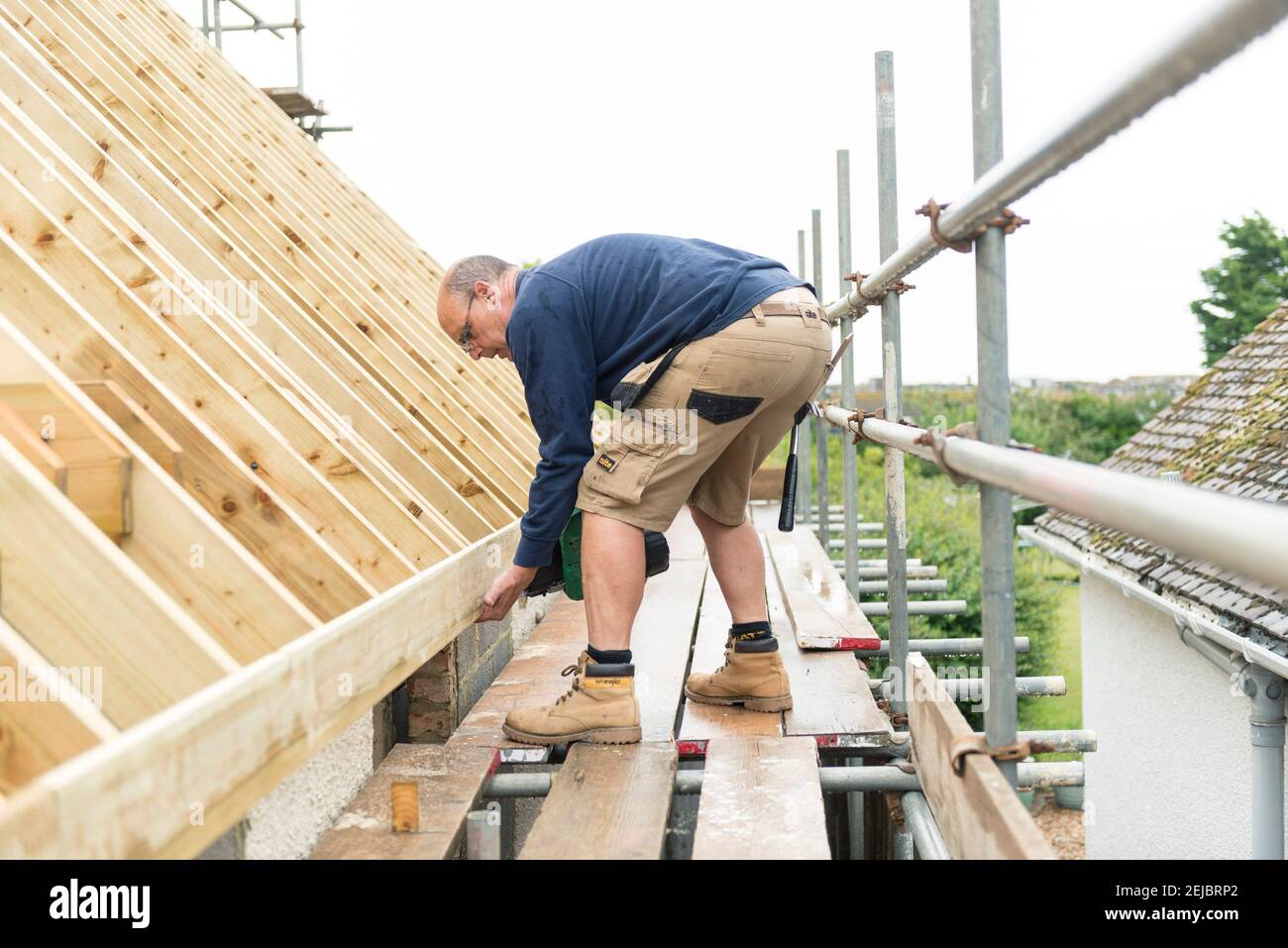 Carpenter nailing roof rafters hi-res stock photography and images - Alamy