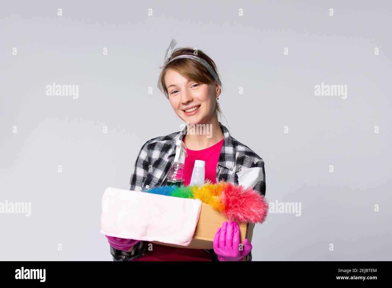 Portrait of maid service woman with cleaning equipment presenting on ...