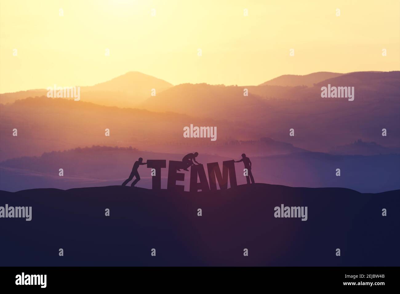 Three people creating TEAM writing on a field. Teamwork and group ...