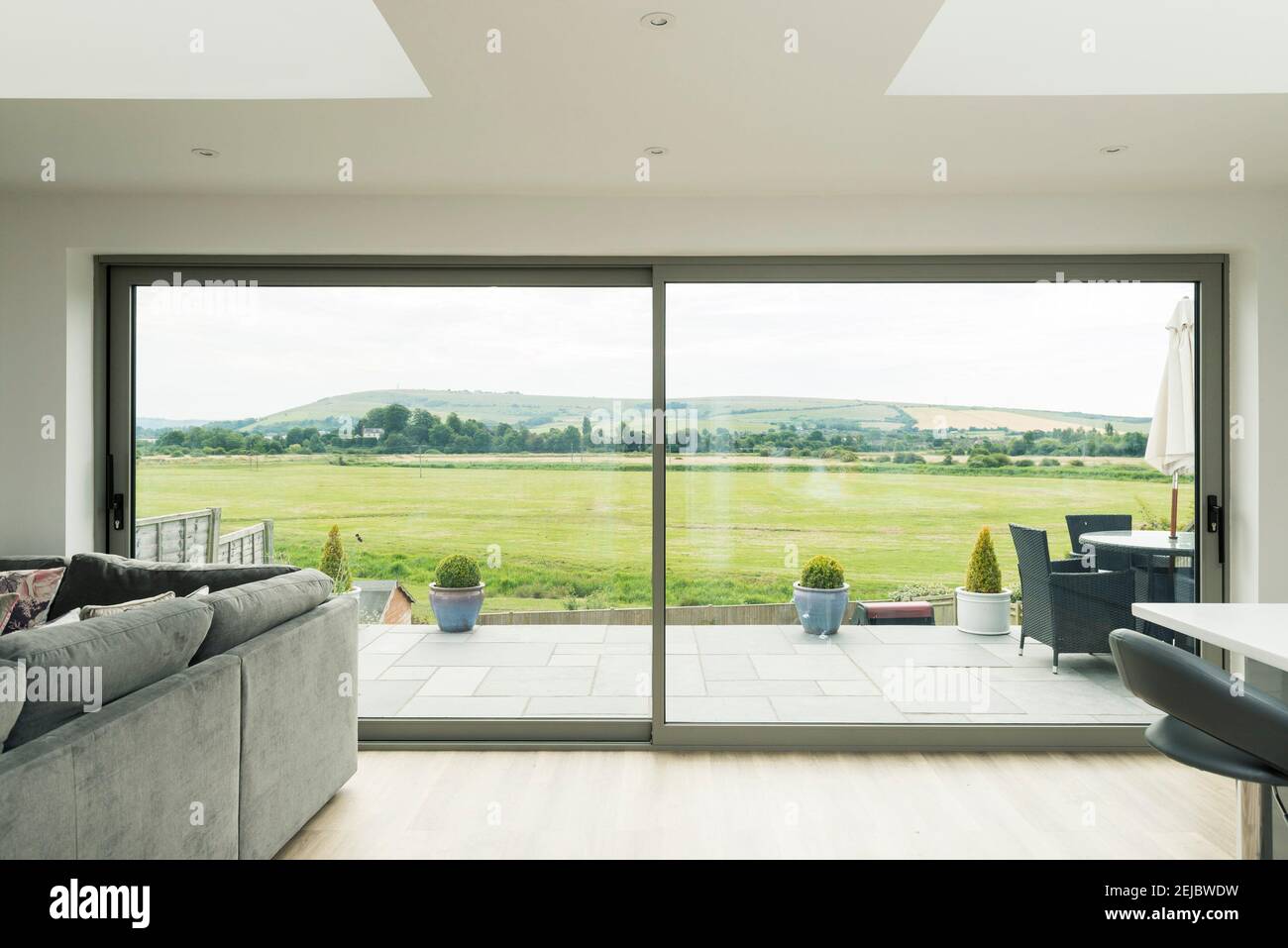 Very big sliding patio double glazed doors opening into a garden Stock ...