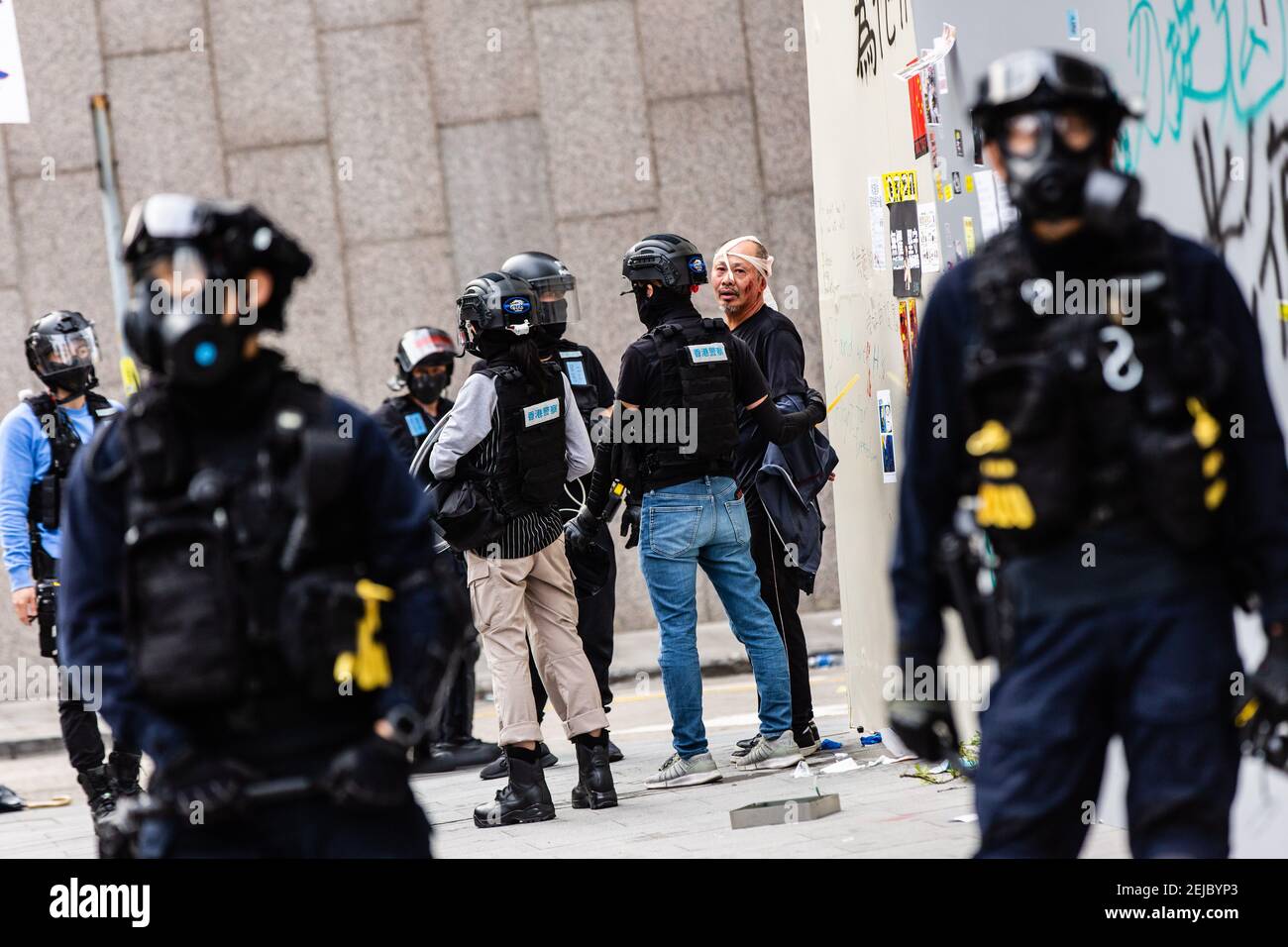 Police officers stand on guard during the rally. Entering the 8th month ...