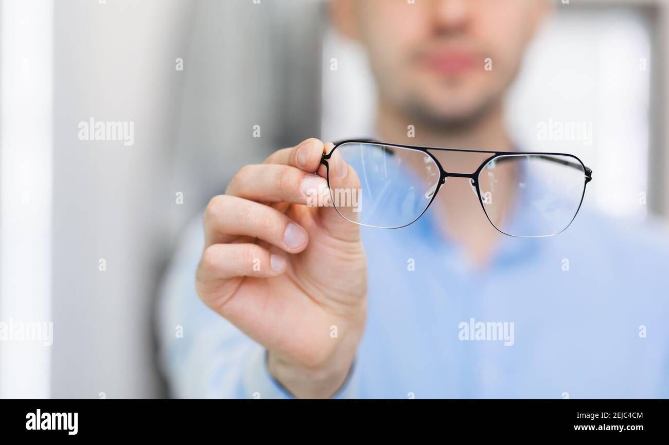 Closeup portrait of man showing spectacles to camera Stock Photo - Alamy