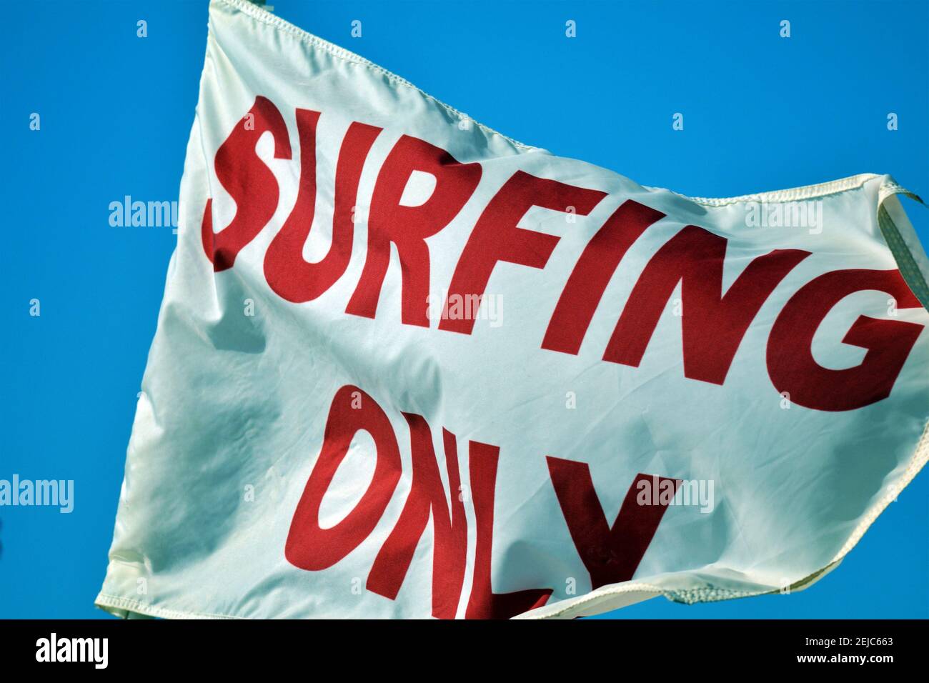 Surfing only beach warning flag Stock Photo - Alamy