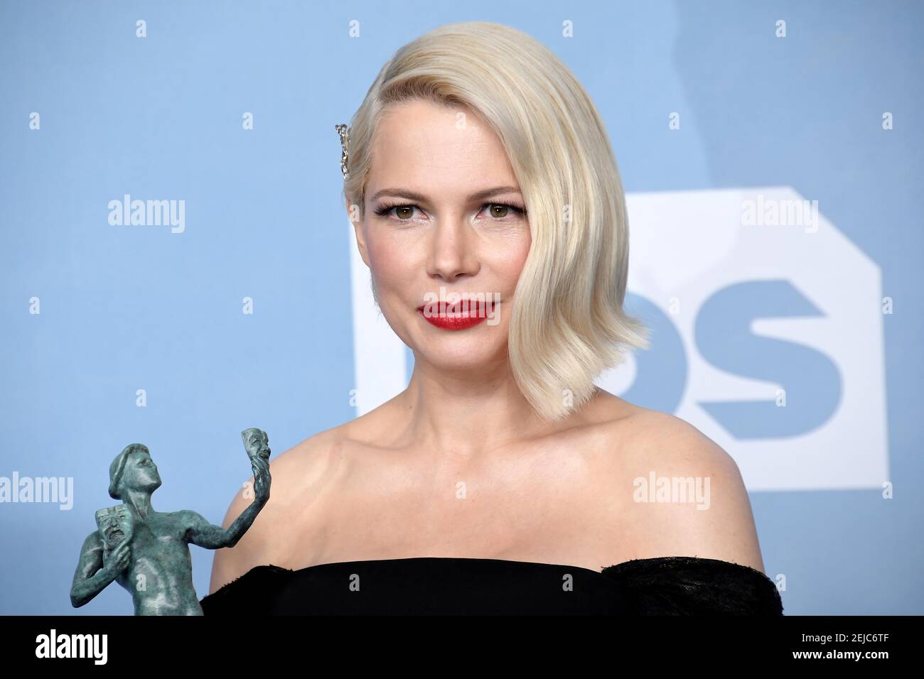 Michelle Williams poses in the press room after winning the award for ...