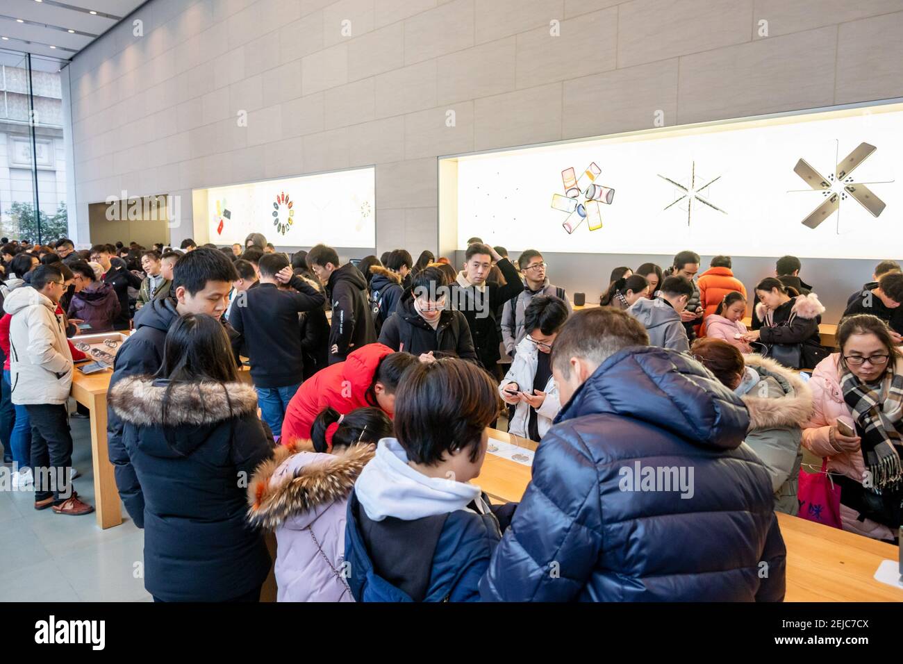 Customers crowd the Apple Store on the Nanjing Road shopping street in ...