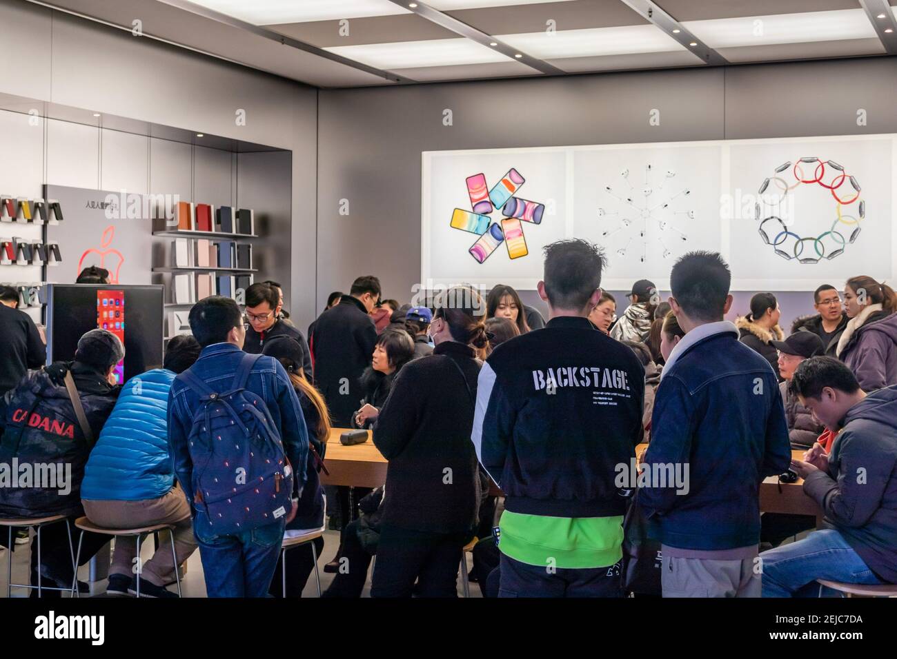 Customers crowd the Apple Store on the Nanjing Road shopping street in ...