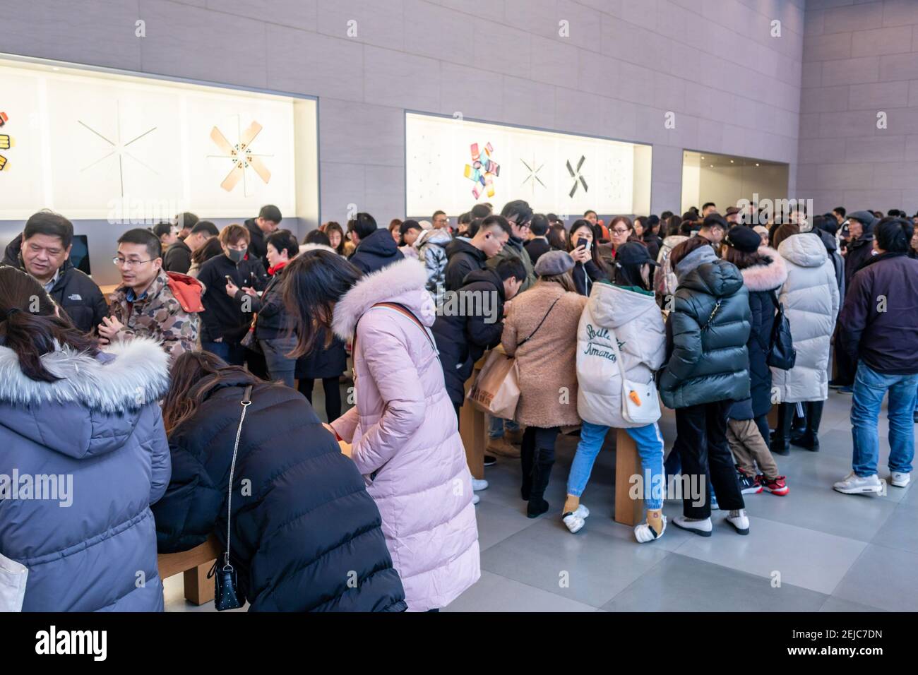 Customers crowd the Apple Store on the Nanjing Road shopping street in ...