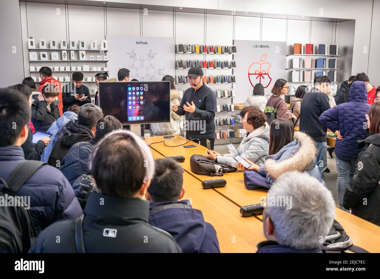 Customers crowd the Apple Store on the Nanjing Road shopping street in ...