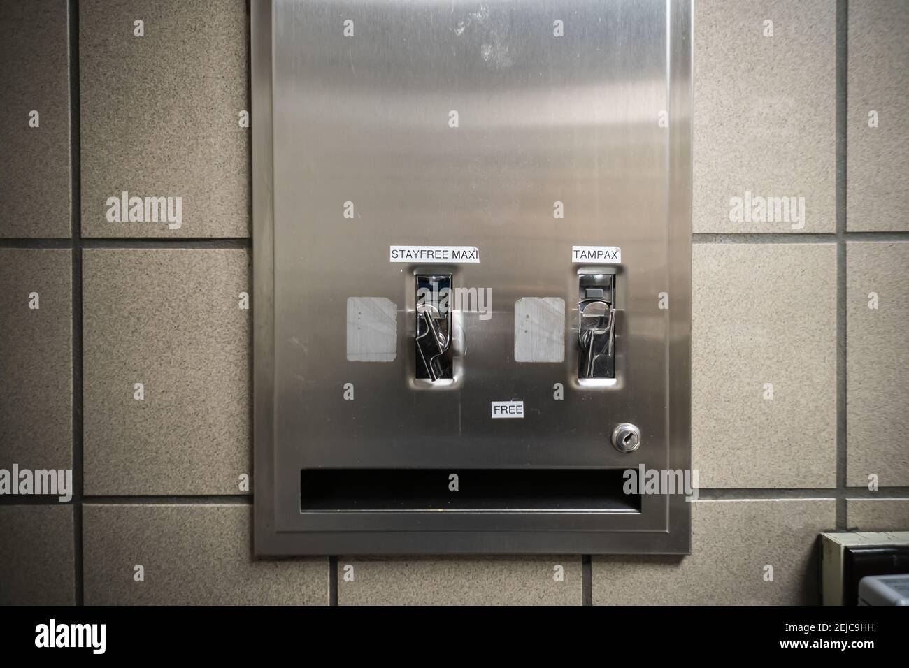 Free tampons and sanitary napkins from a vending machine in a public ...