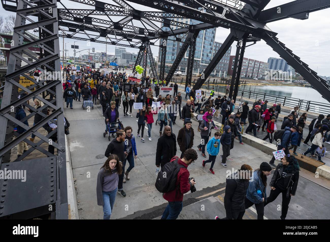 People march across the Lefty O'Doul Bridge in San Francisco ...