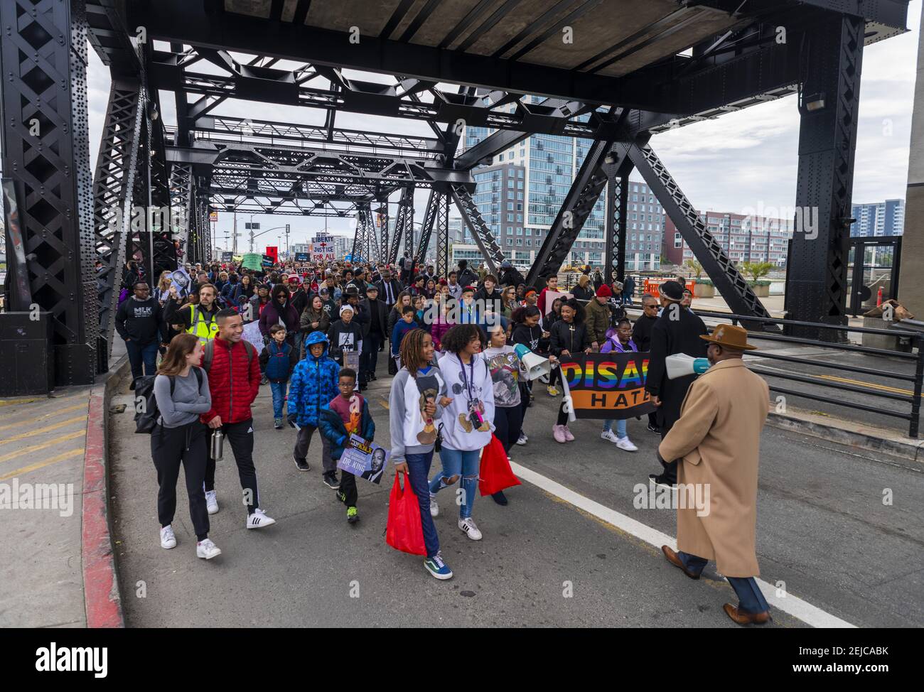 People march across the Lefty O'Doul Bridge in San Francisco ...