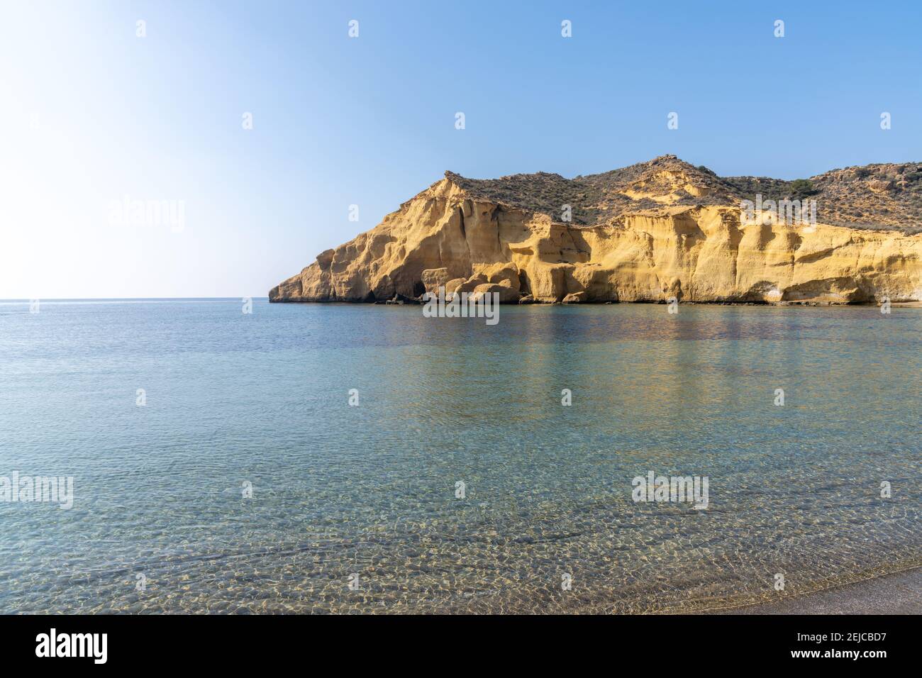 View of calm idyllic ocean water in the Mediterranean with yellow ...
