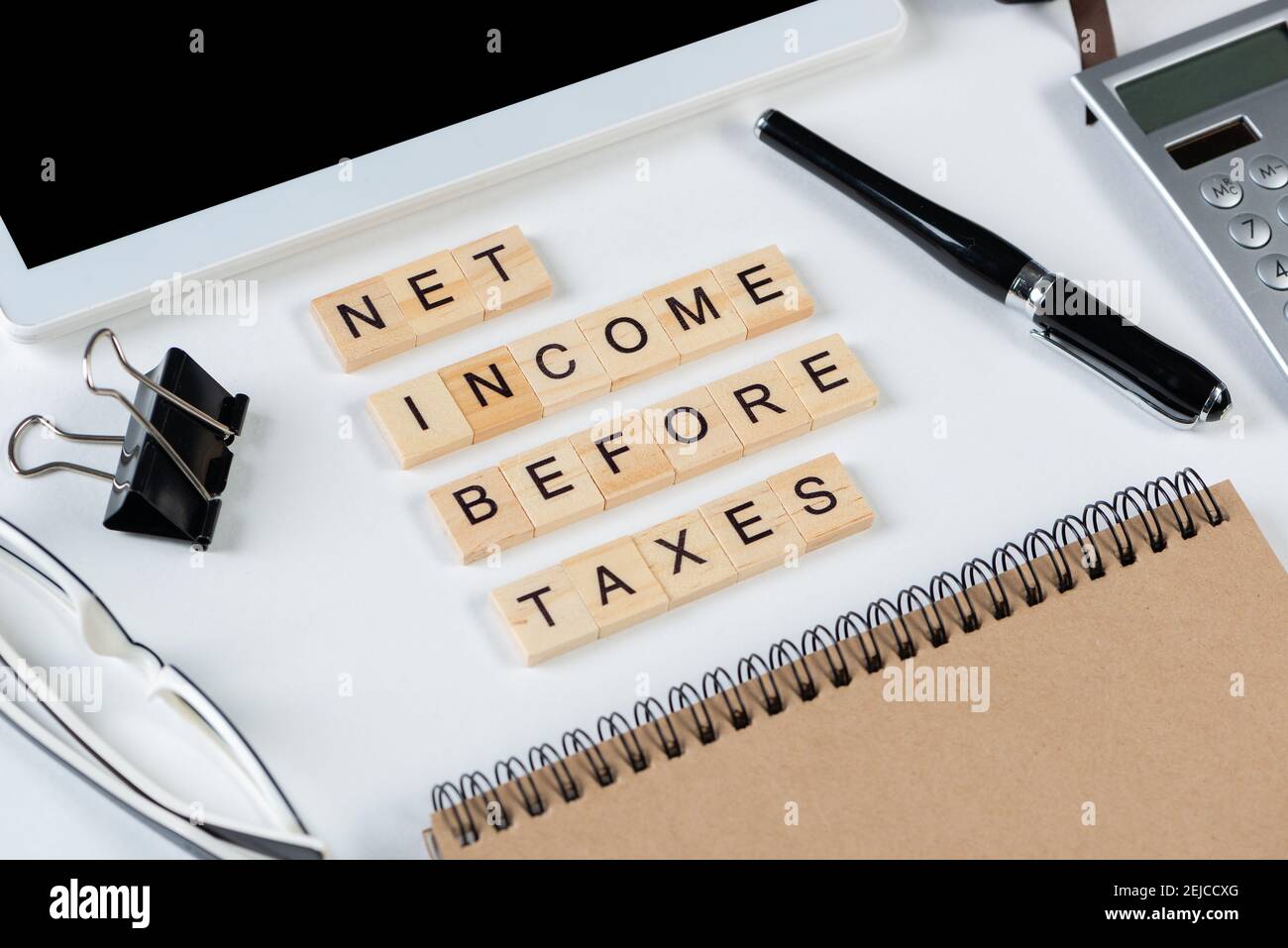Net income before taxes concept with letters Stock Photo - Alamy