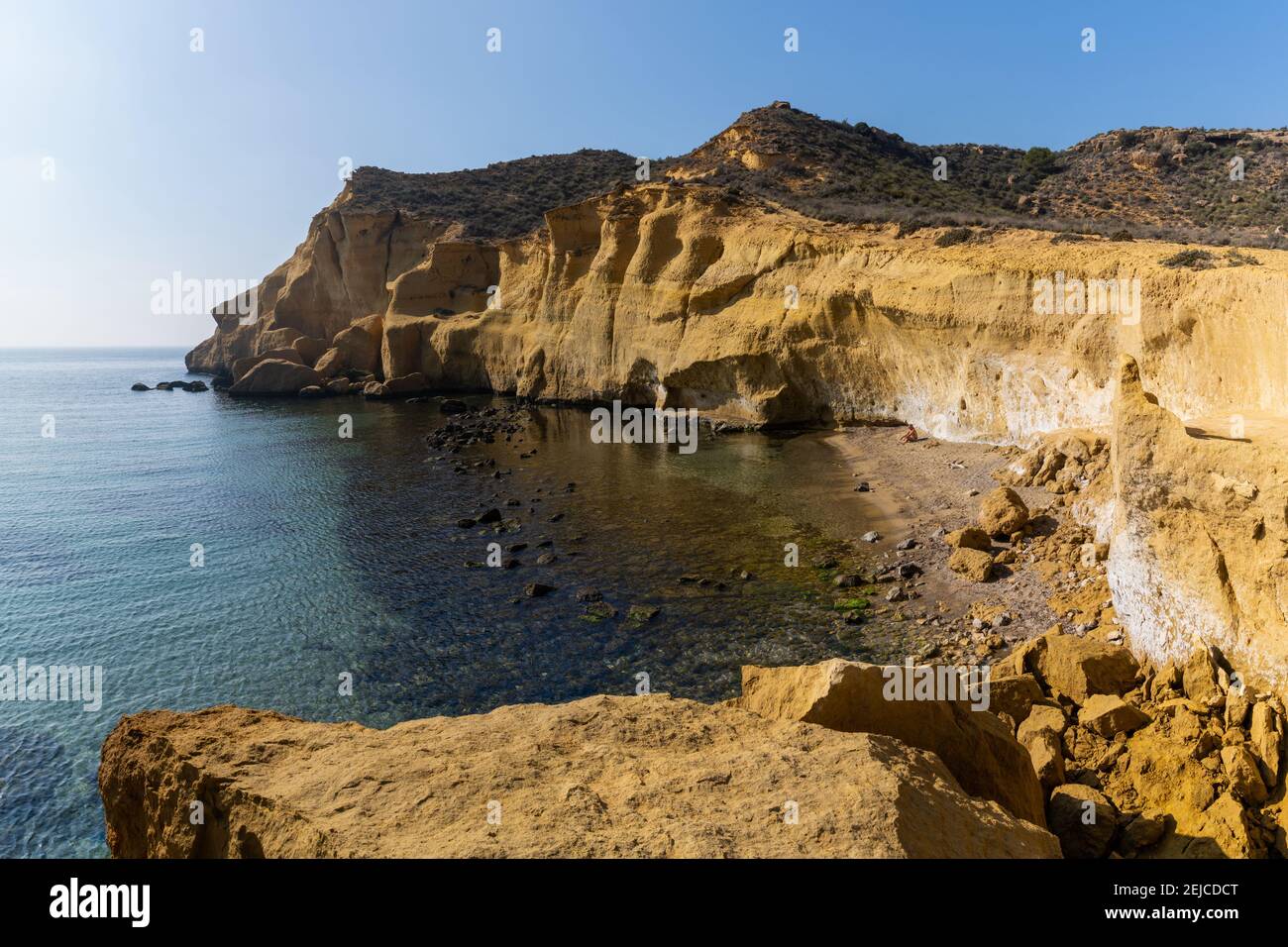 View of calm idyllic ocean water in the Mediterranean with yellow ...